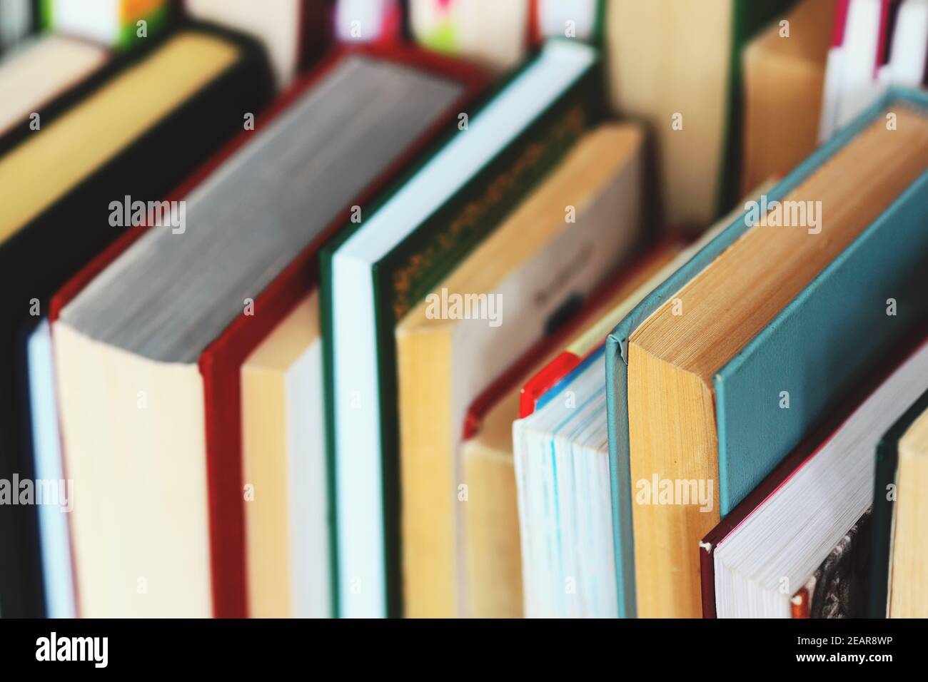 This is a lot of books standing together in several rows. Solid ...