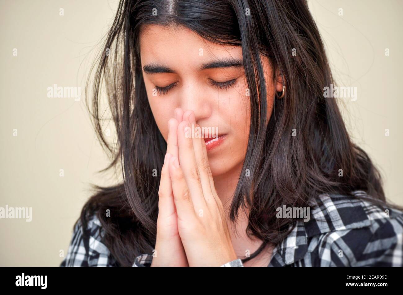 Christian teenager praying at home Stock Photo - Alamy