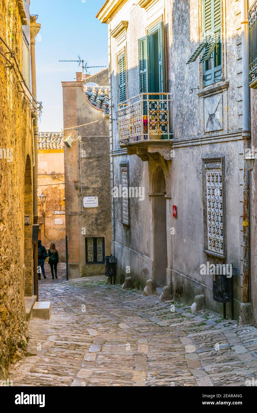 View of a narrow street in the historical center of Erice village on ...