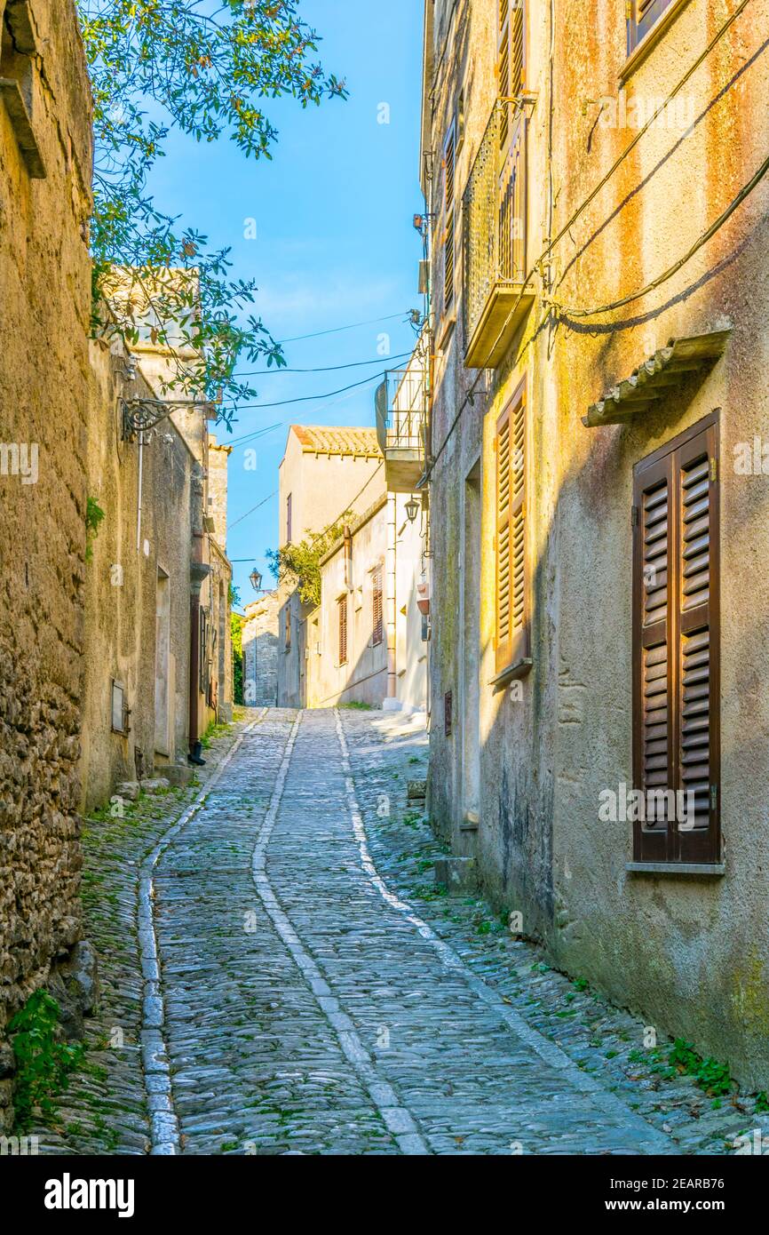 View of a narrow street in the historical center of Erice village on ...