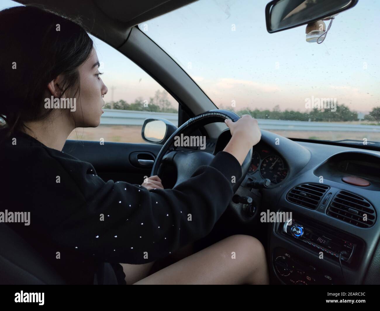 Girl driving a car Stock Photo - Alamy