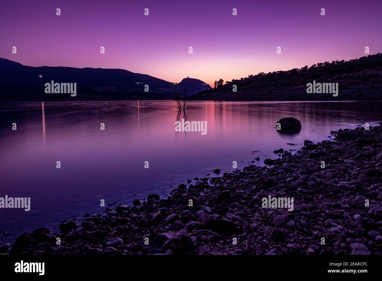 Sunset in a castle over a lake in a calm place Stock Photo - Alamy