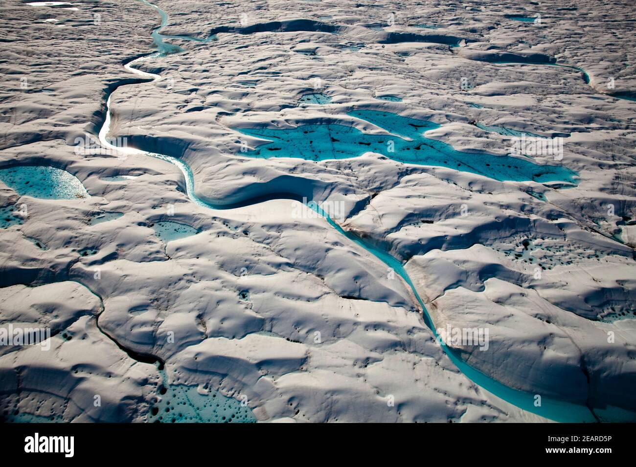 Aerial views of Melt Pools and melt rivers on Petermann Glacier, in ...