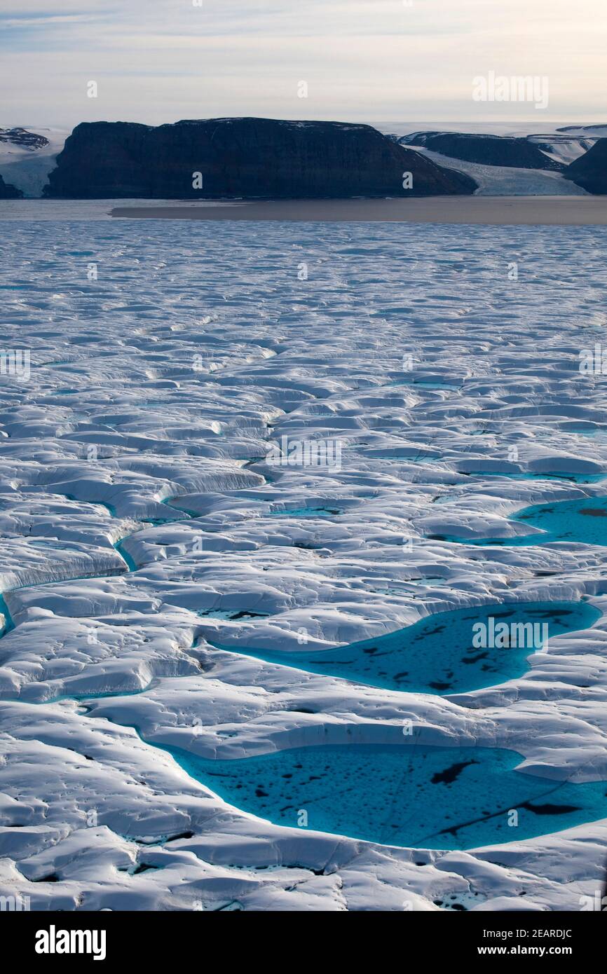 Aerial views of Melt Pools and melt rivers on Petermann Glacier, in ...
