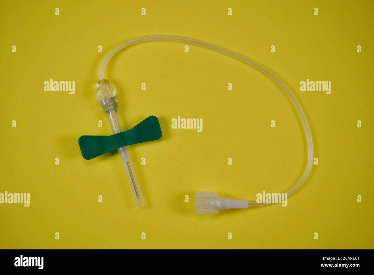 Blood collection infusion set on yellow background Stock Photo - Alamy