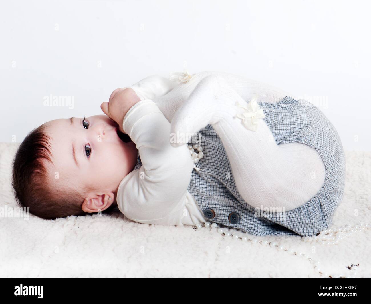 little girl plays with her stuffed legs Stock Photo - Alamy
