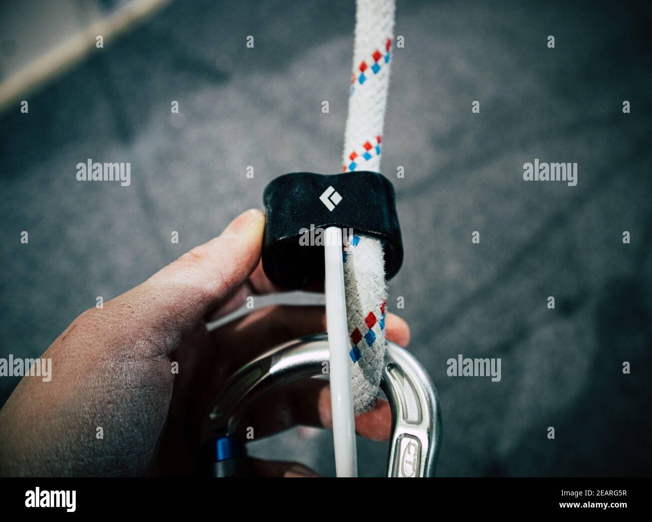 Belay device with carabiner and rope Stock Photo - Alamy