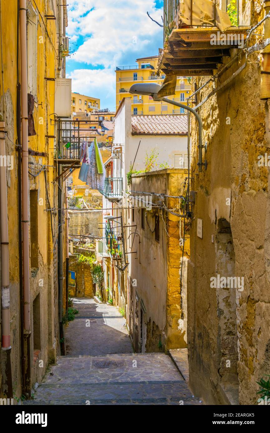View of a narrow street in the historical city of Agrigento in Sicily ...