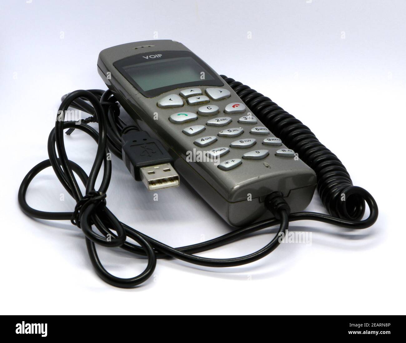 Photo of an Old corded grey Voipfone on a white background Stock Photo ...