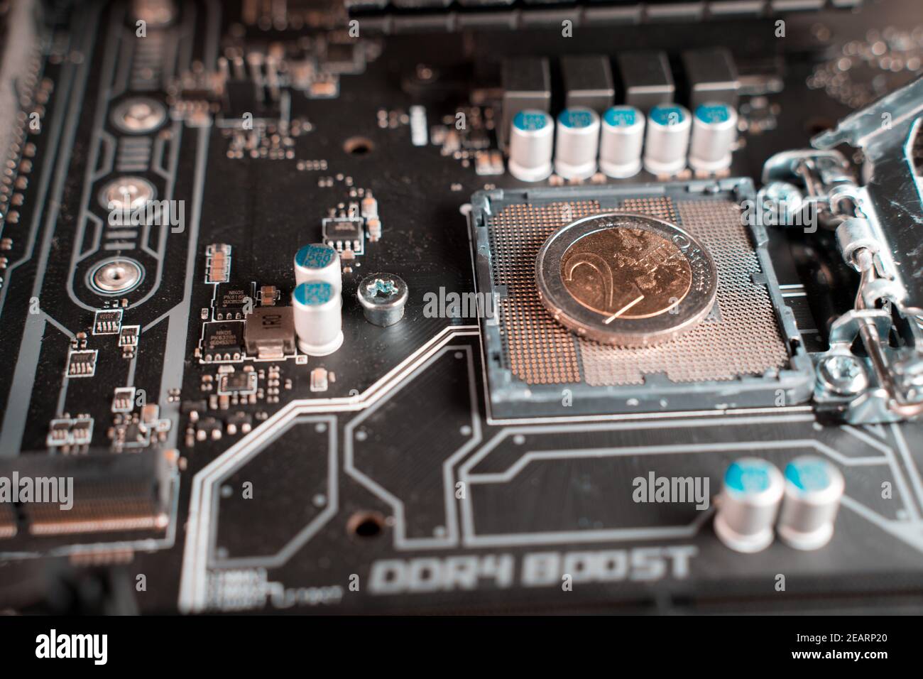2 euro coin over a CPU slot in a motherboard, symbolizing the Digital ...