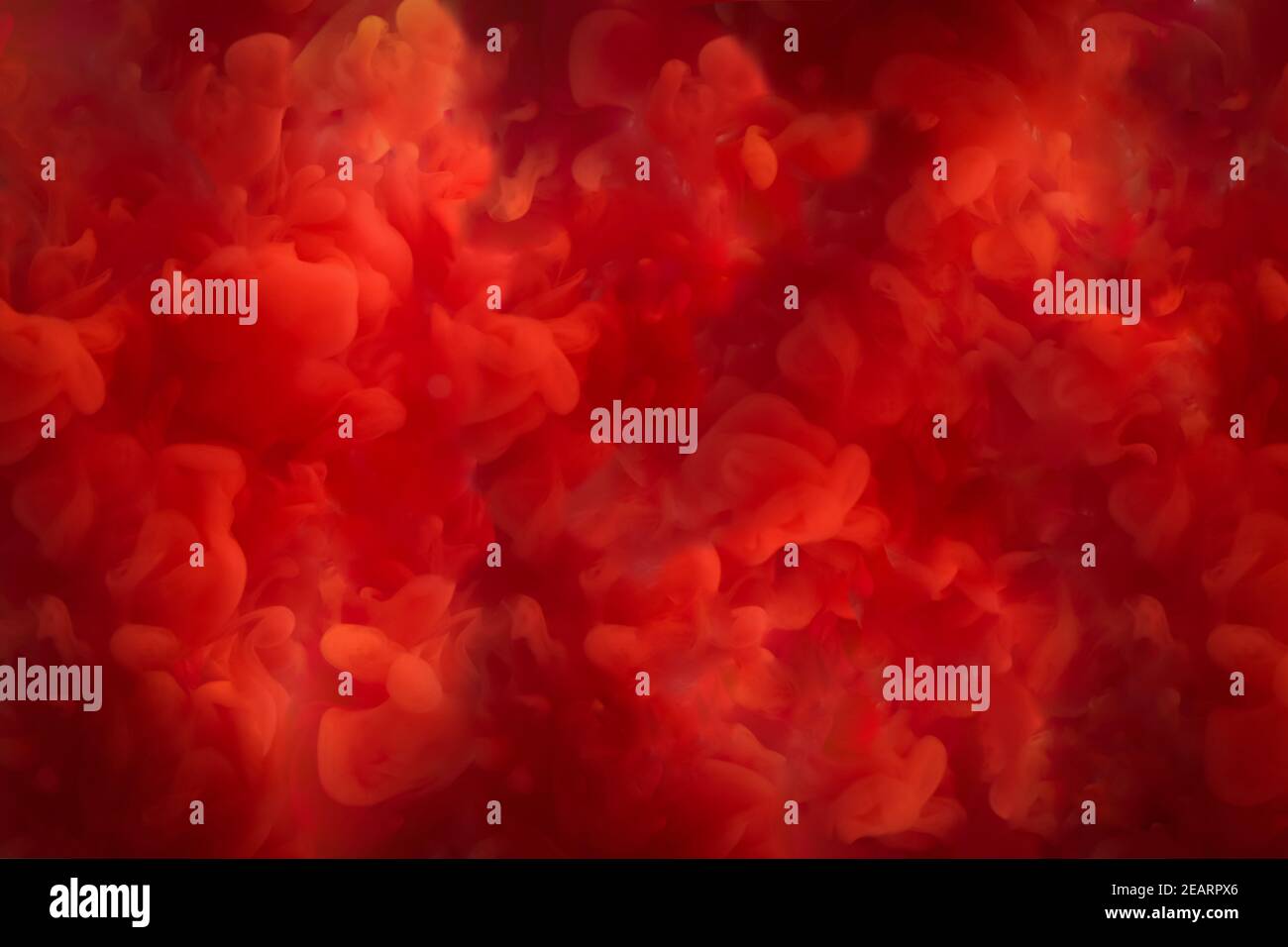 Beautiful red liquid abstract background with colored paint in water ...