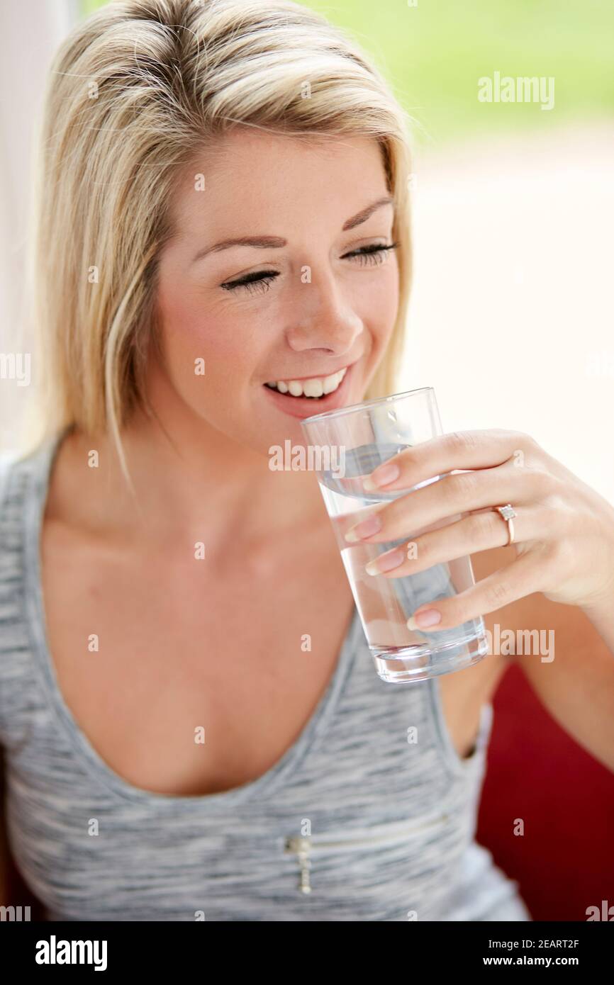 Woman drinking water Stock Photo - Alamy