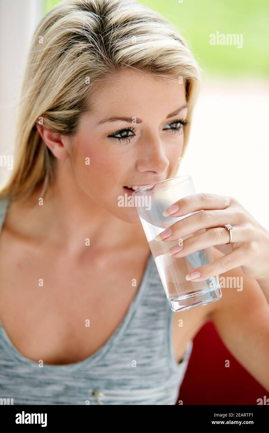 Woman drinking water Stock Photo - Alamy