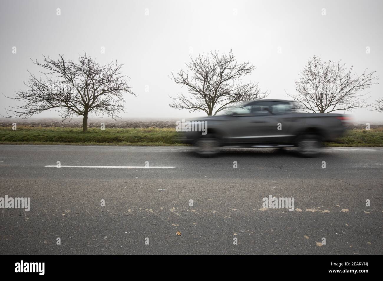 Motion blurred truck going fast on a rural road Stock Photo - Alamy