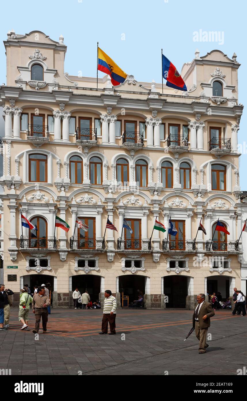 ornate old building, varied window styles, balconies, hotel, flags ...