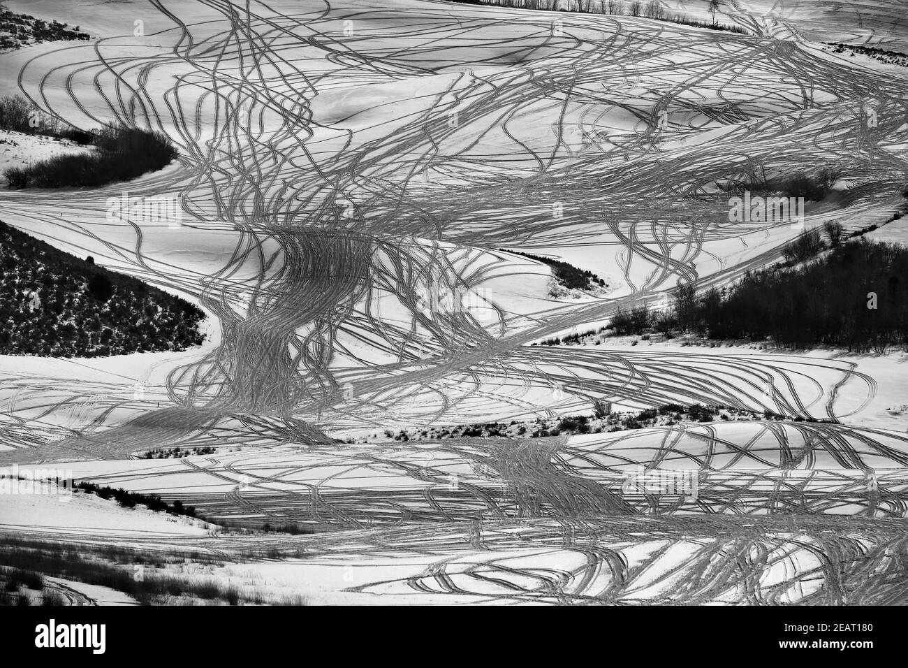 Snow path snowmobiles mountains tracks trails Stock Photo - Alamy