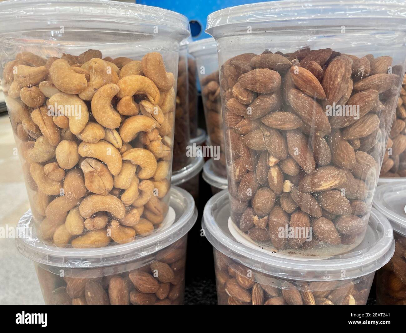 Plastic containers full of nuts Stock Photo - Alamy