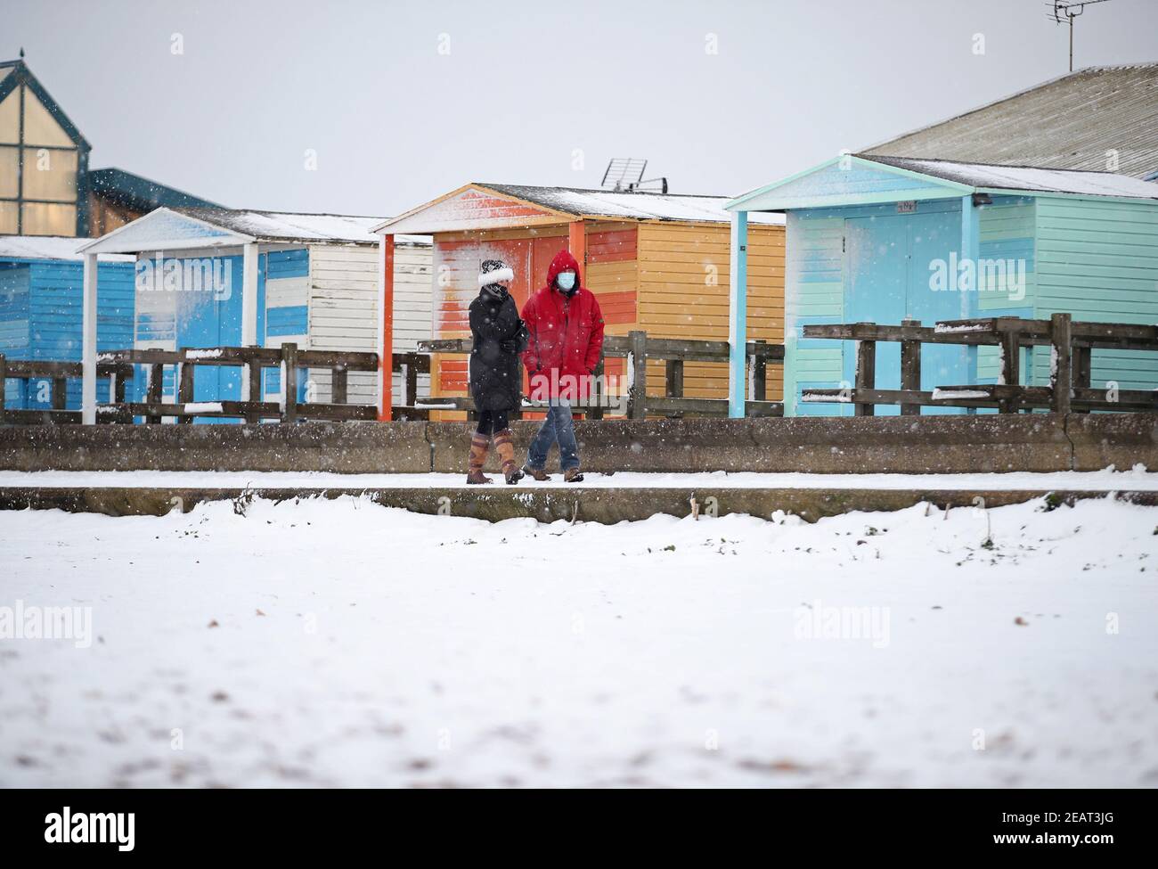 Snow falls on Whitstable beach in Kent, as the cold snap continues to ...