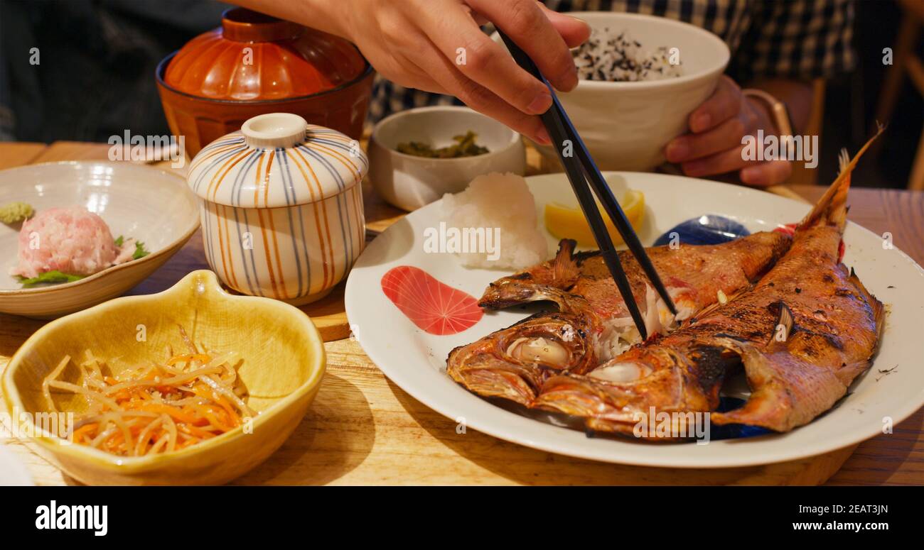 Set of the Japanese meal with bowl of rice and grilled fish Stock Photo ...