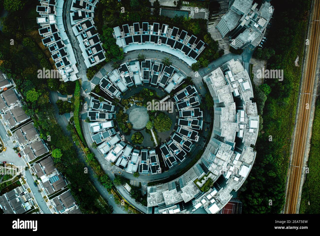 Aerial view of green trees and concrete buildings in a park Stock Photo ...