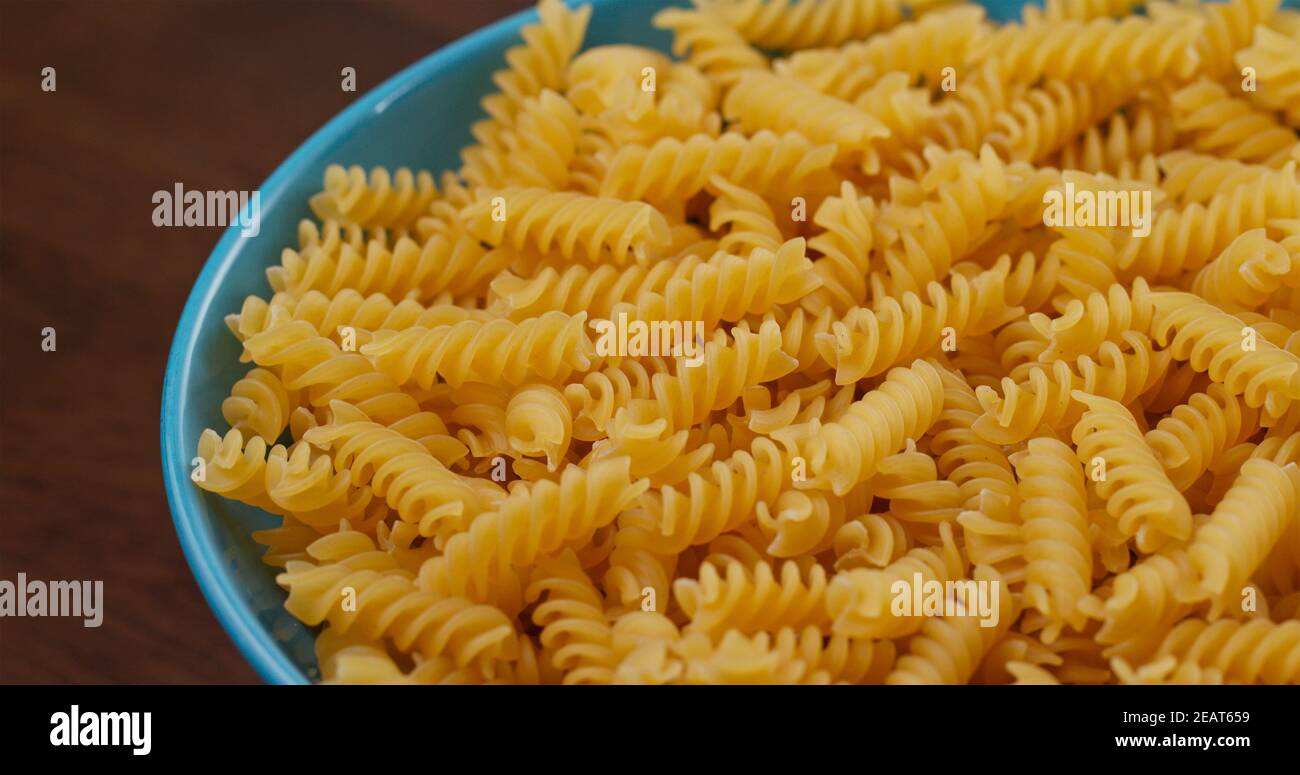 Stack of fusilli on plate Stock Photo - Alamy