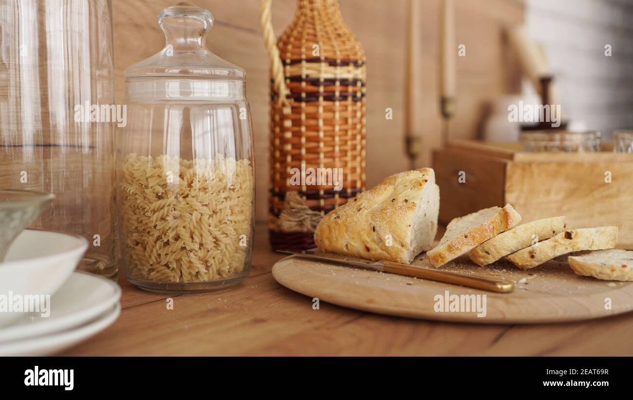 Sliced white bread on a wooden tray. Modern Scandinavian style kitchen ...
