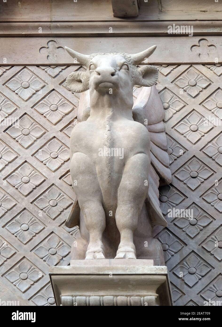 Winged ox symbol of St. Luke the Evangelist, statue on the facade of ...