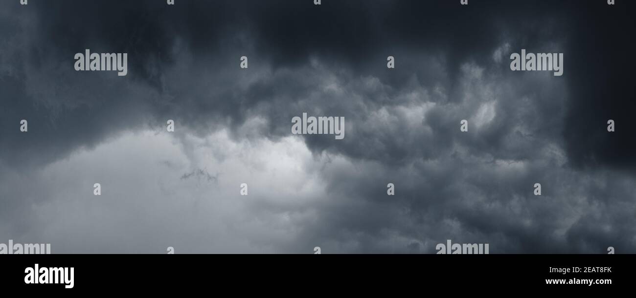 Background of dark stormy ominous clouds in gray moody sky Stock Photo ...