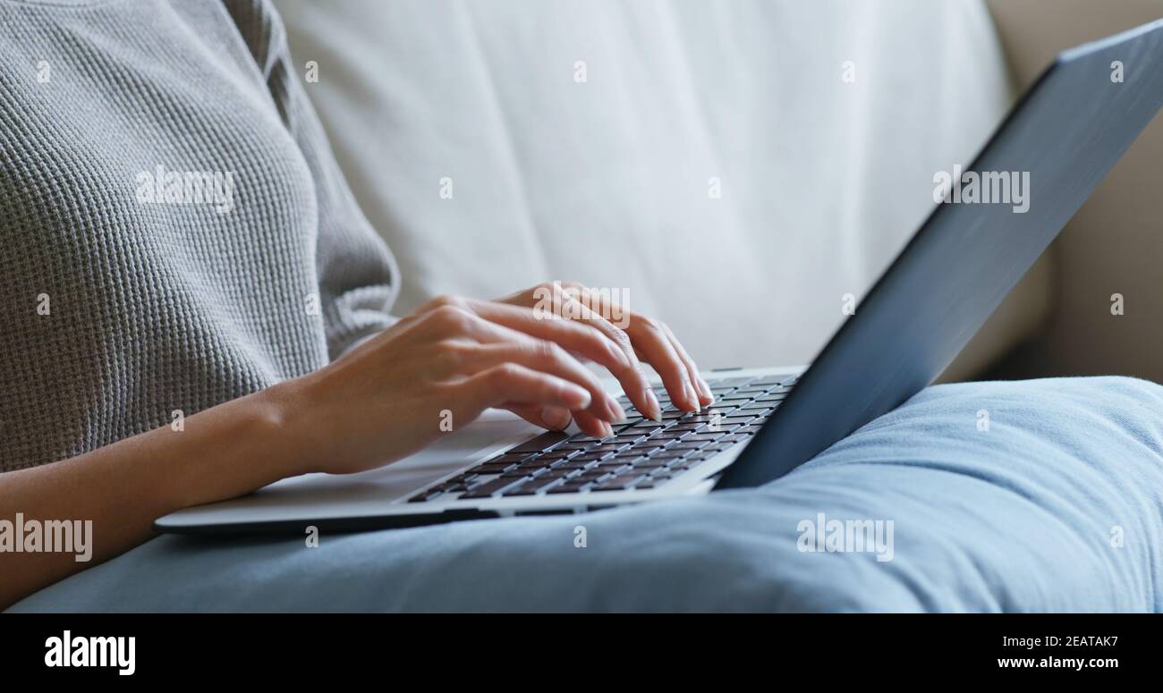 Woman type on laptop computer Stock Photo - Alamy