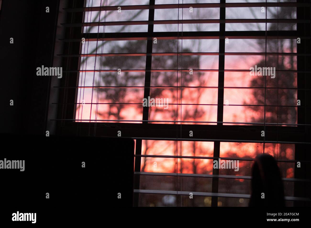 Sunset through the office window Stock Photo - Alamy