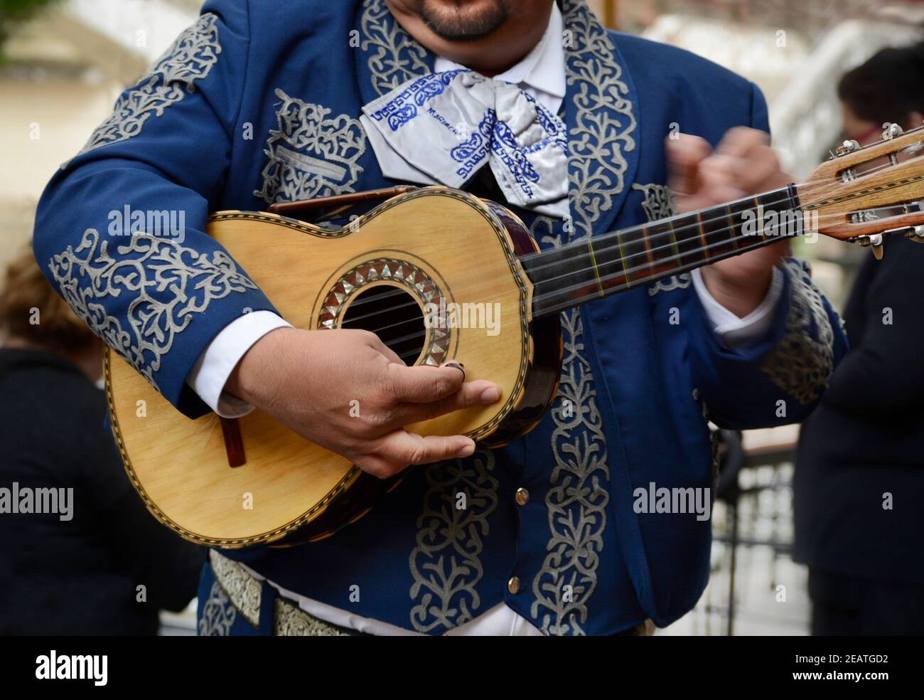 Members of a mariachi band entertain tourists and other visitors along ...