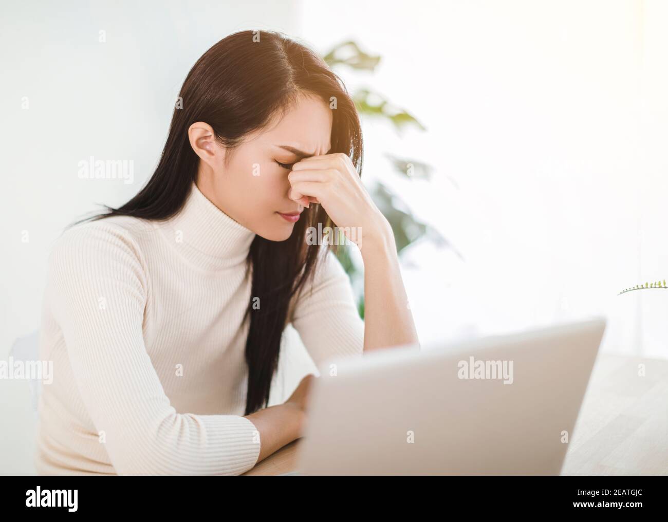 stressed young woman working with computer at home Stock Photo - Alamy