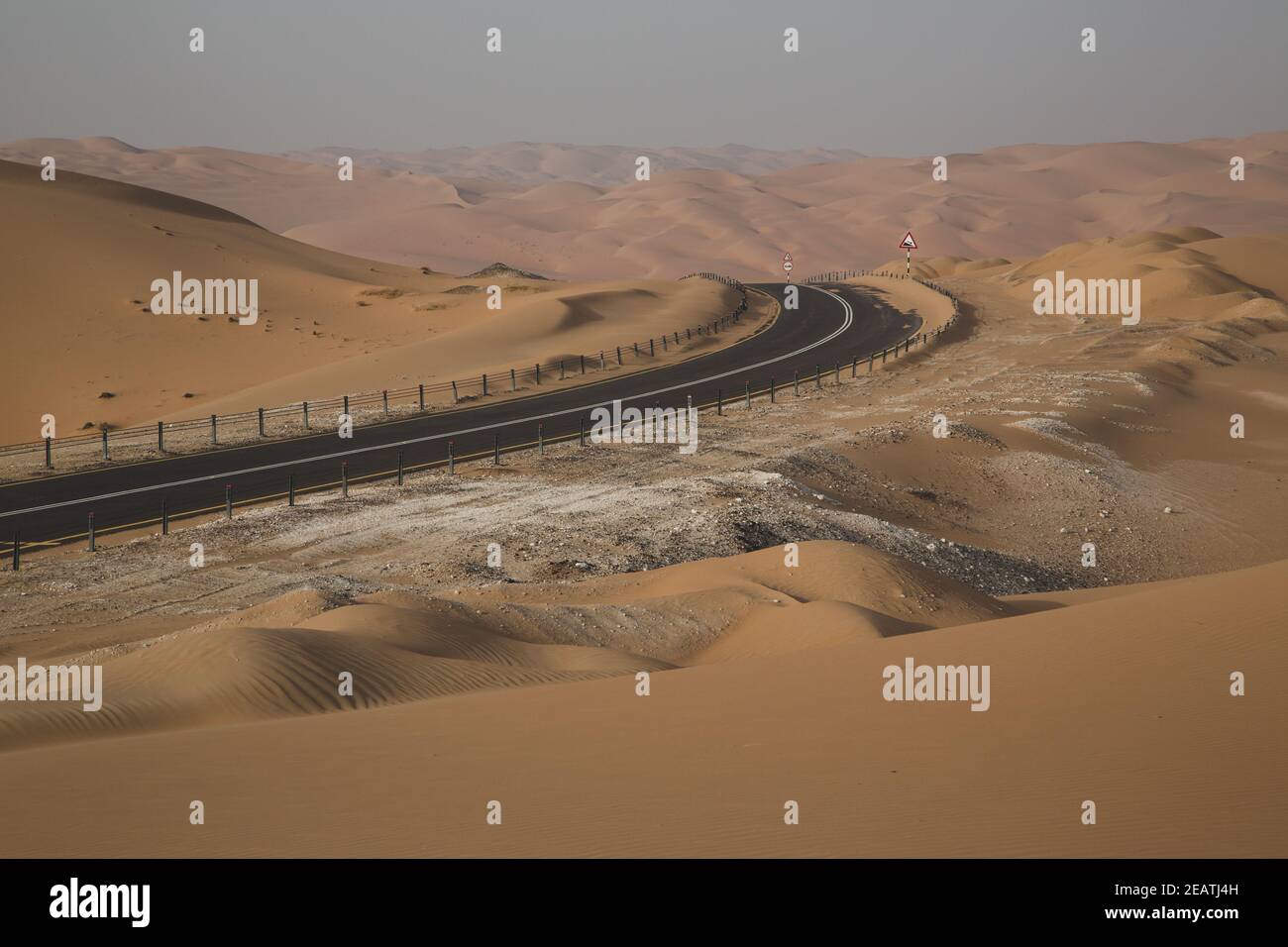 Empty road through endless desert Stock Photo - Alamy