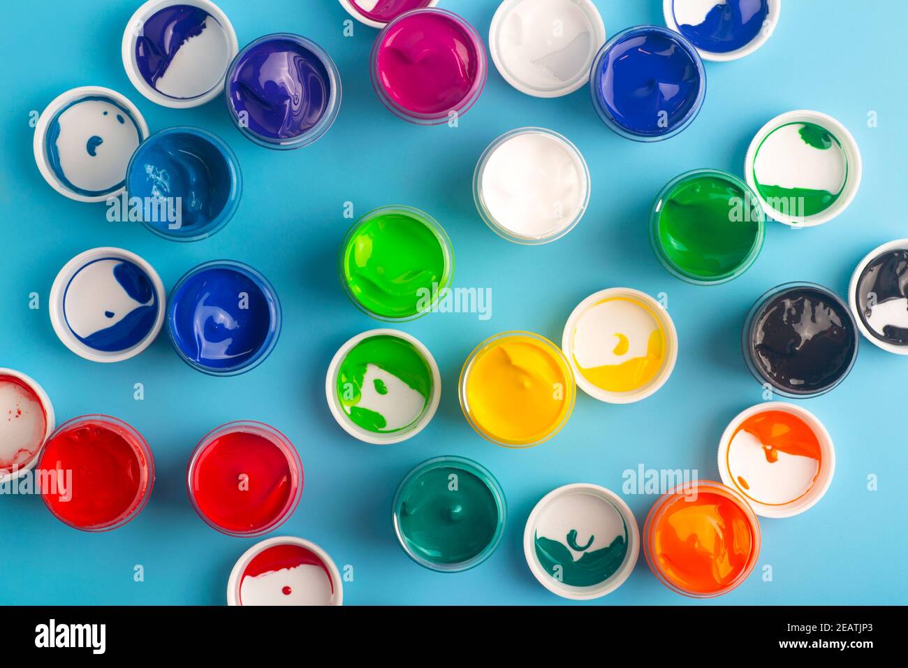 Acrylic paints of various colors for drawing are open on the table ...