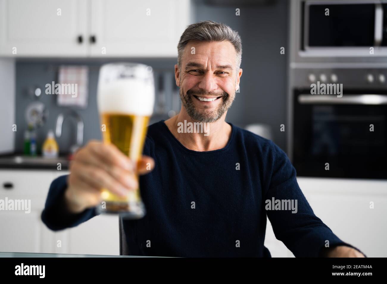 Man Drinking Beverage Beer In Video Conference Stock Photo - Alamy