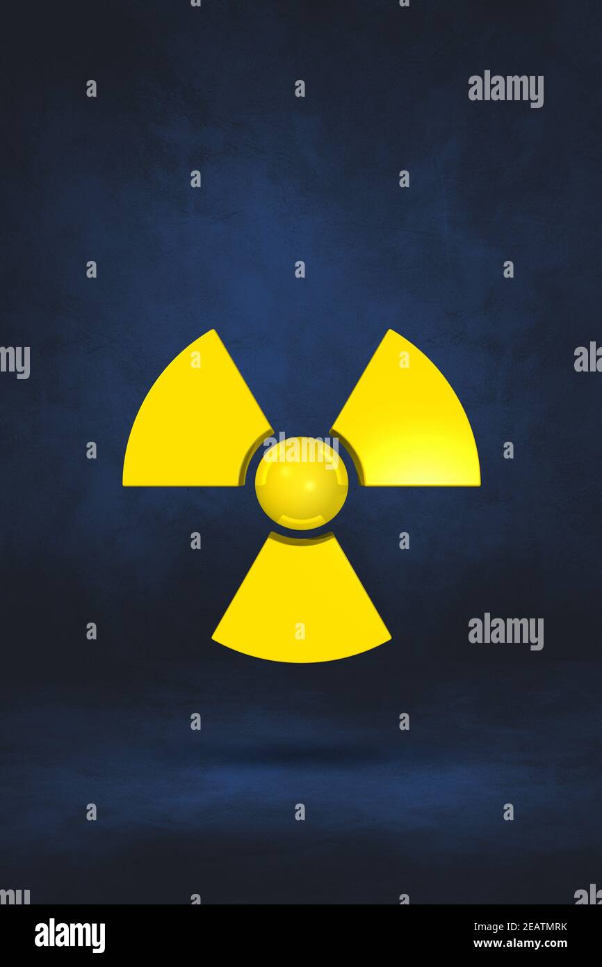 Radioactive symbol on a dark blue studio background Stock Photo - Alamy