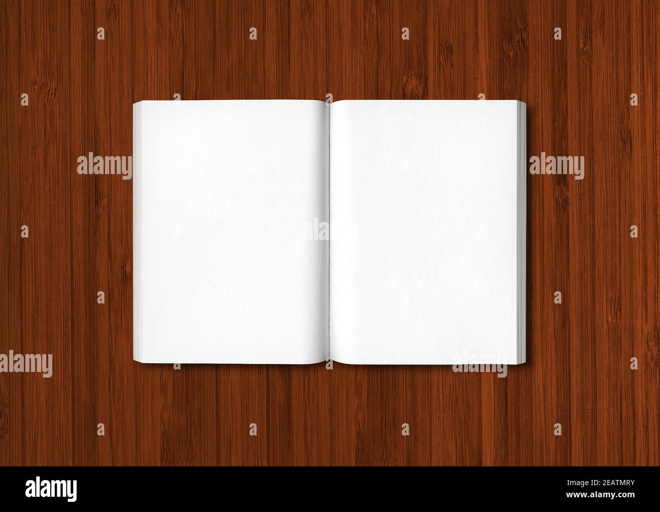 Open book isolated on dark wooden Stock Photo - Alamy