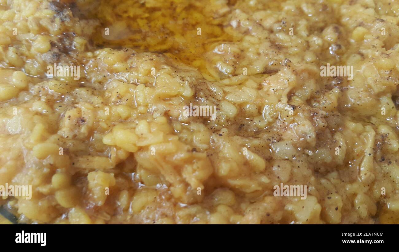 A close up view spicy daal dish served with ghee on it Stock Photo - Alamy