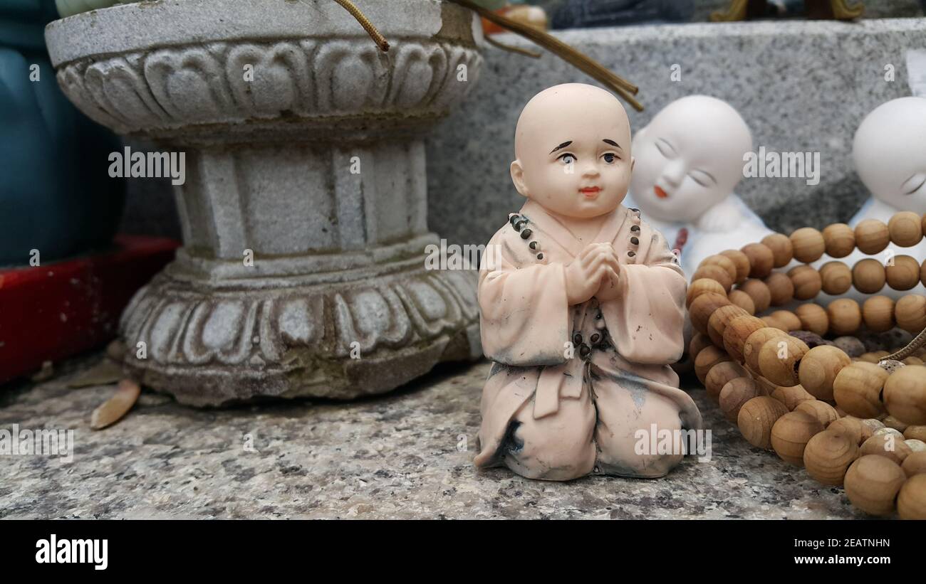 Buddha mini statue with beautiful background Stock Photo - Alamy