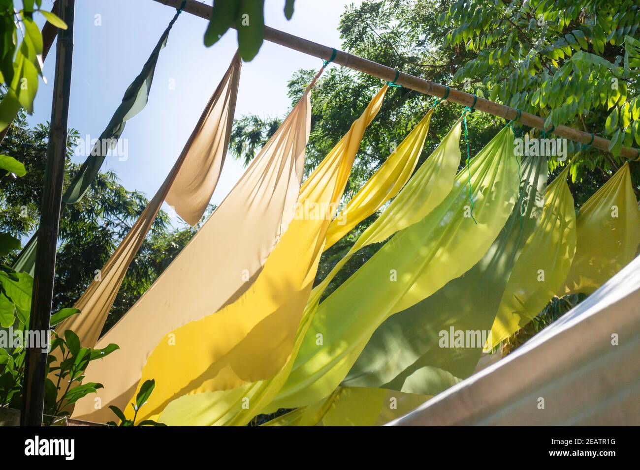 Hanging colorful fabric decorated in the garden Stock Photo - Alamy