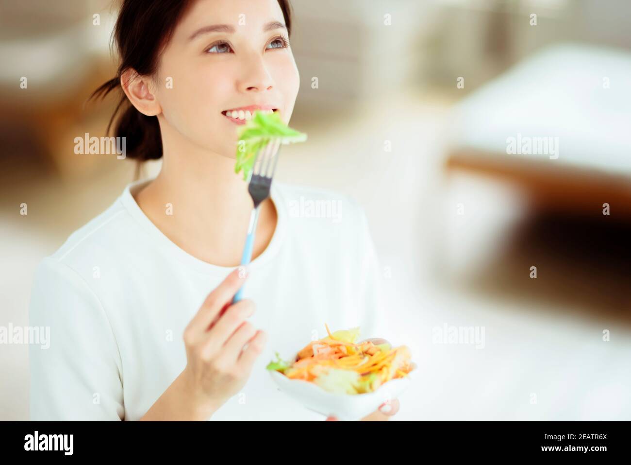 Woman healthy eating fun hi-res stock photography and images - Alamy