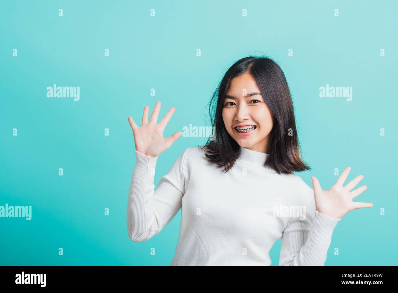 woman cheerful smiling makeup showing open hands Stock Photo - Alamy
