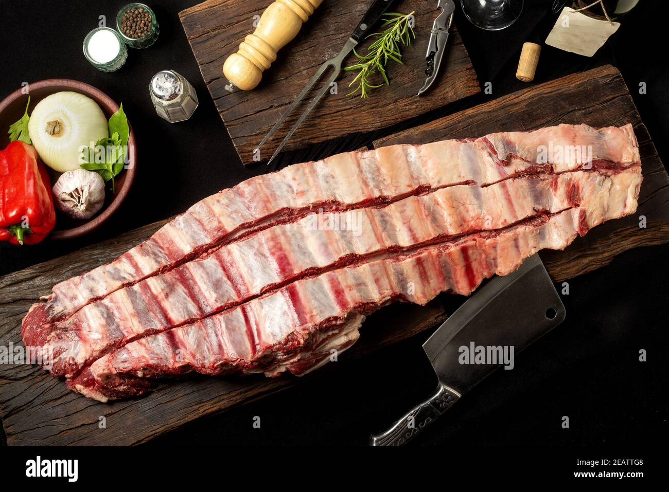 Fresh raw pork ribs on a cutting wooden board with spices Stock Photo ...