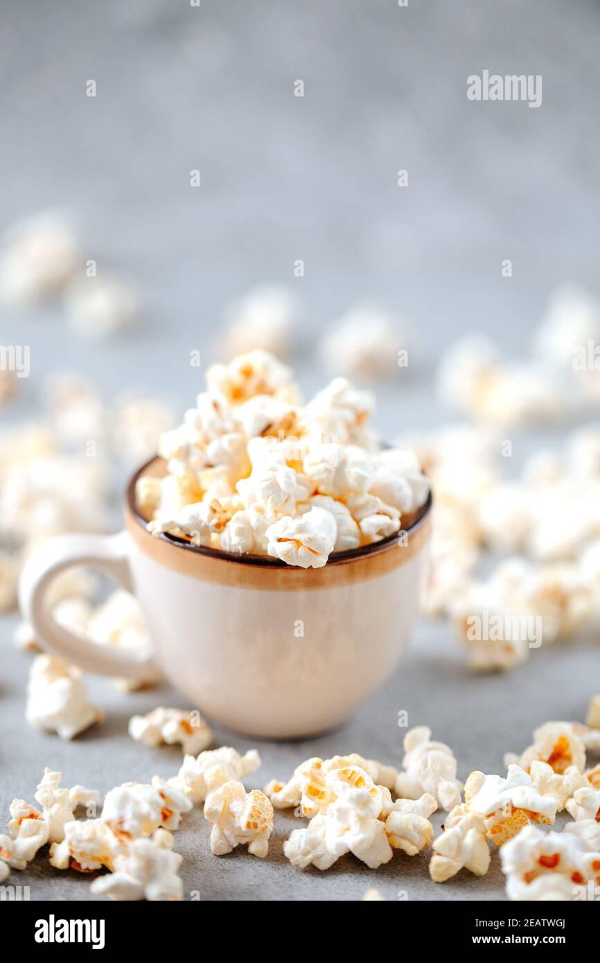Homemade popcorn in a ceramic bowl on a grey background Stock Photo - Alamy