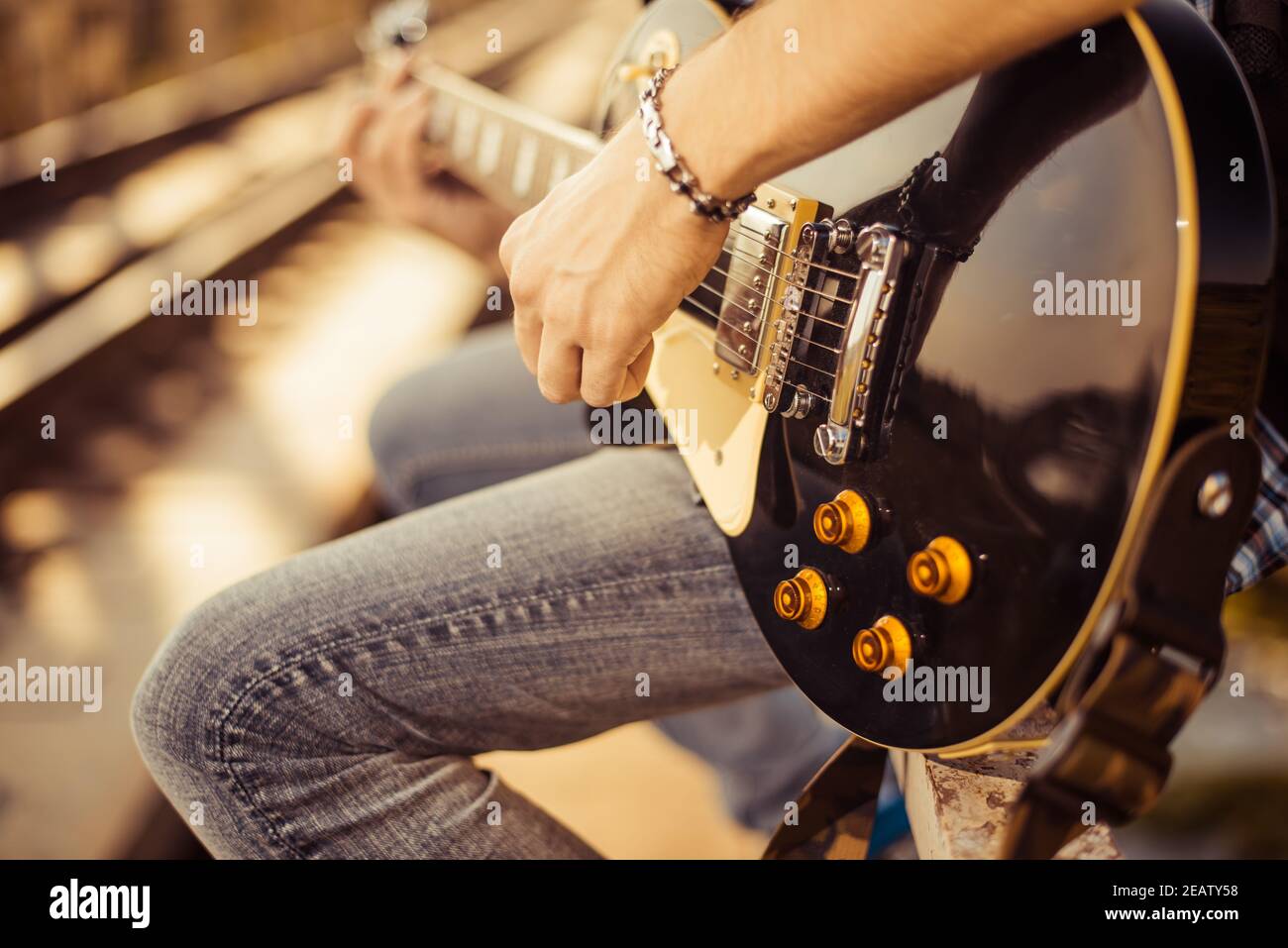 guitar player playing song outdoor Stock Photo - Alamy