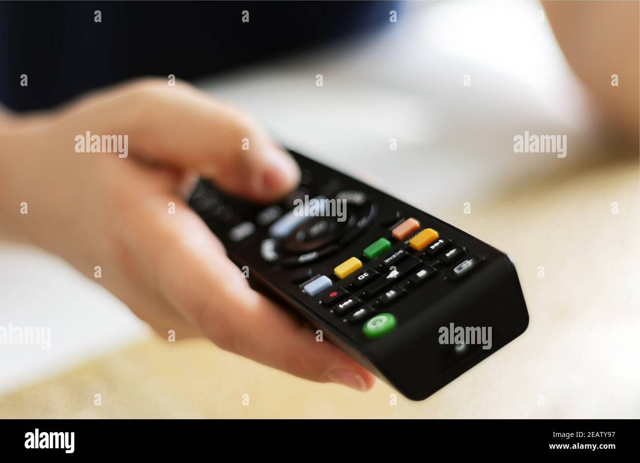 Holding tv remote control hi-res stock photography and images - Alamy