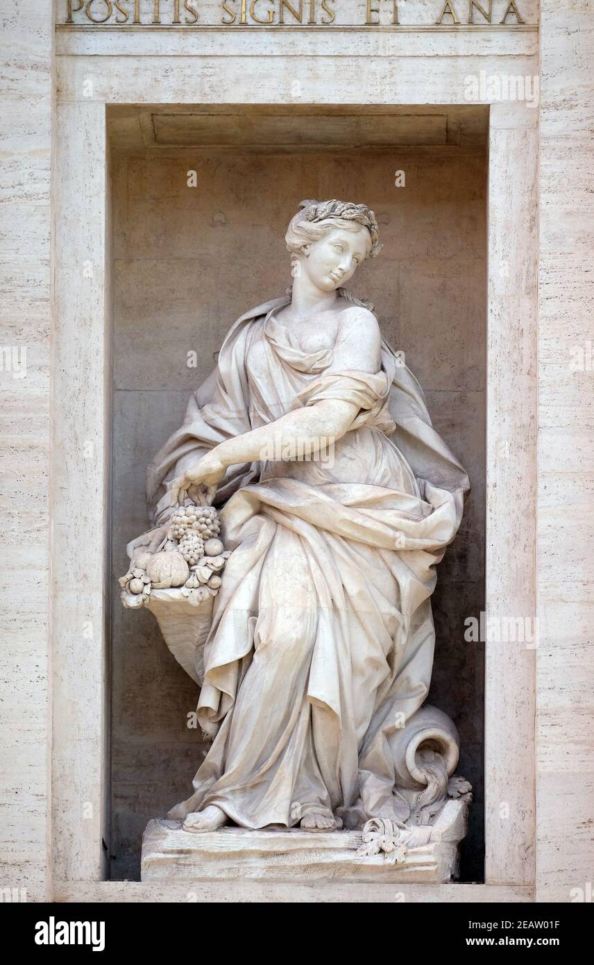 The statue of Abundance of the Trevi Fountain in Rome. Fontana di Trevi ...