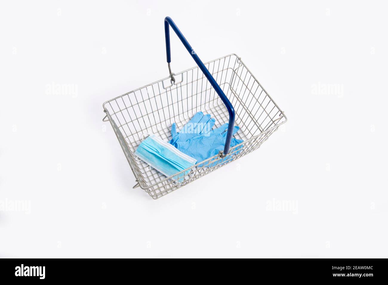 Shopping basket with hand gloves and mouth mask, isolated on white ...