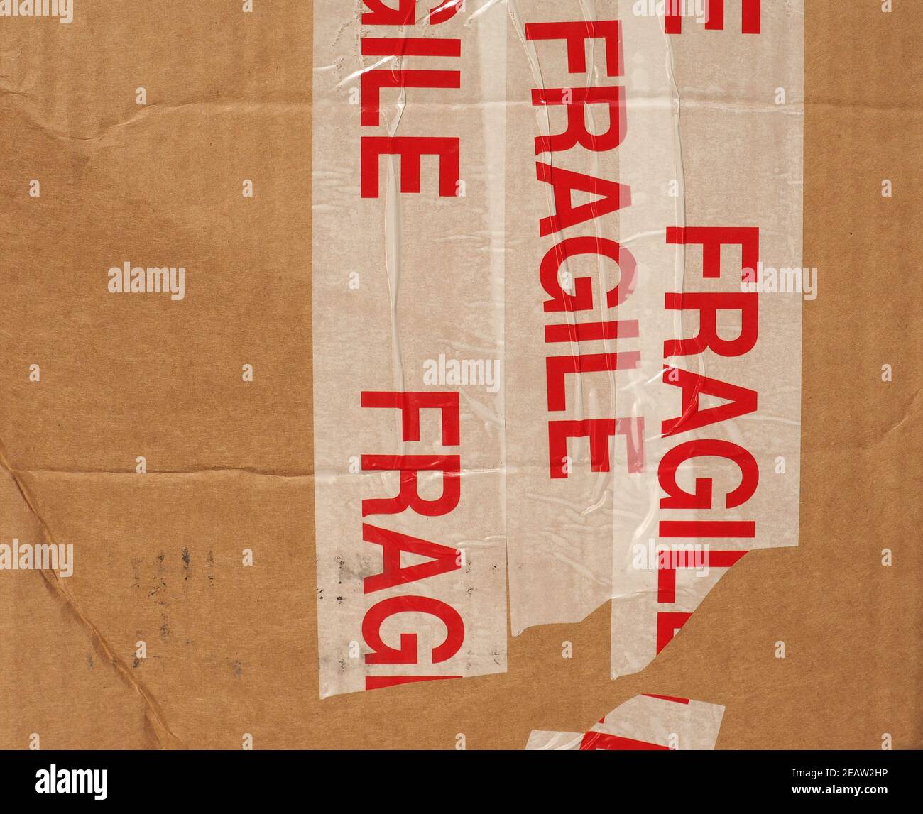 fragile on cardboard packet Stock Photo - Alamy