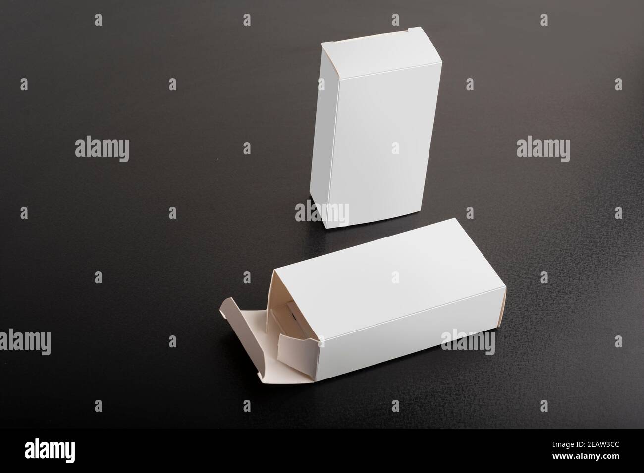 Two small packages on dark background mock-up series 297 Stock Photo ...